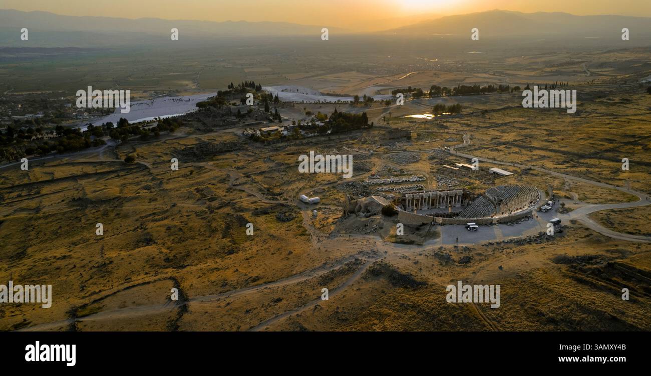 Aerial view of hierapolis ancient theater ruins at sunset surrounded by ...