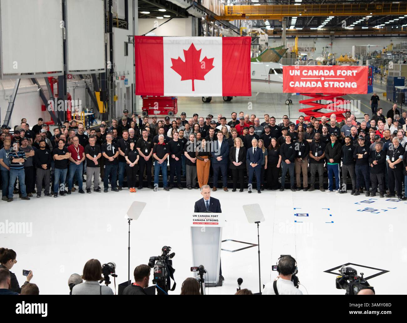 Liberal Leader Mark Carney makes an announcement at Bombardier during a ...