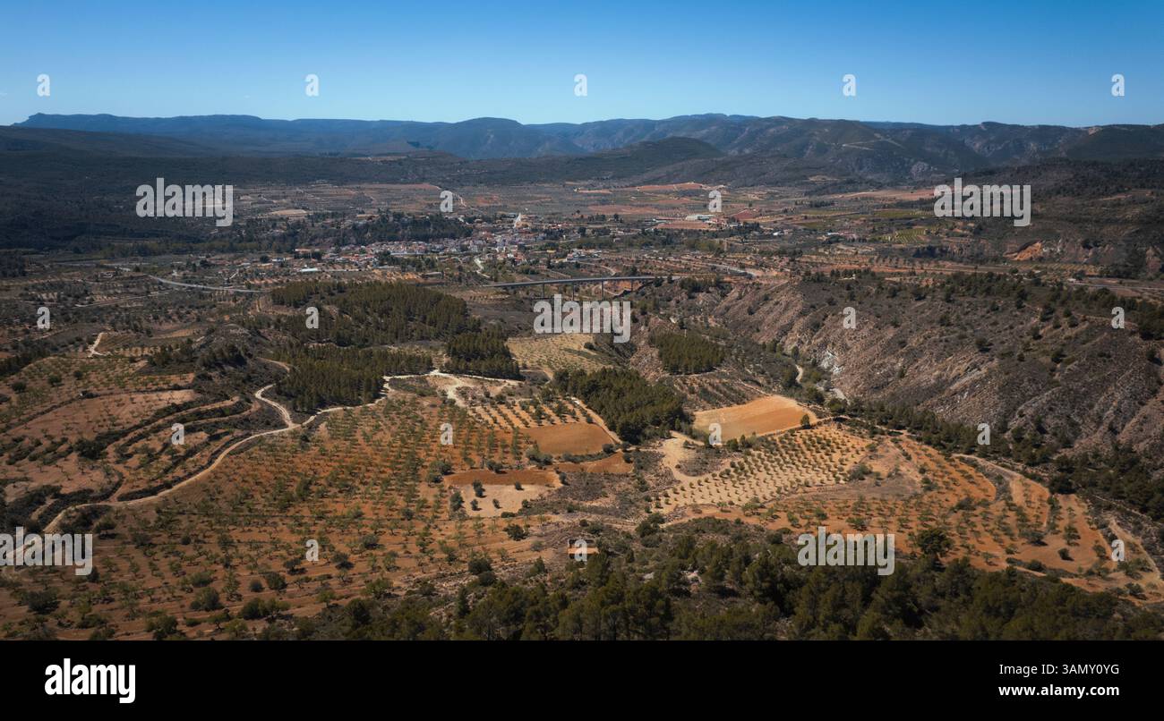 Panoramic Aerial view of a warm coloured valley with a small village ...