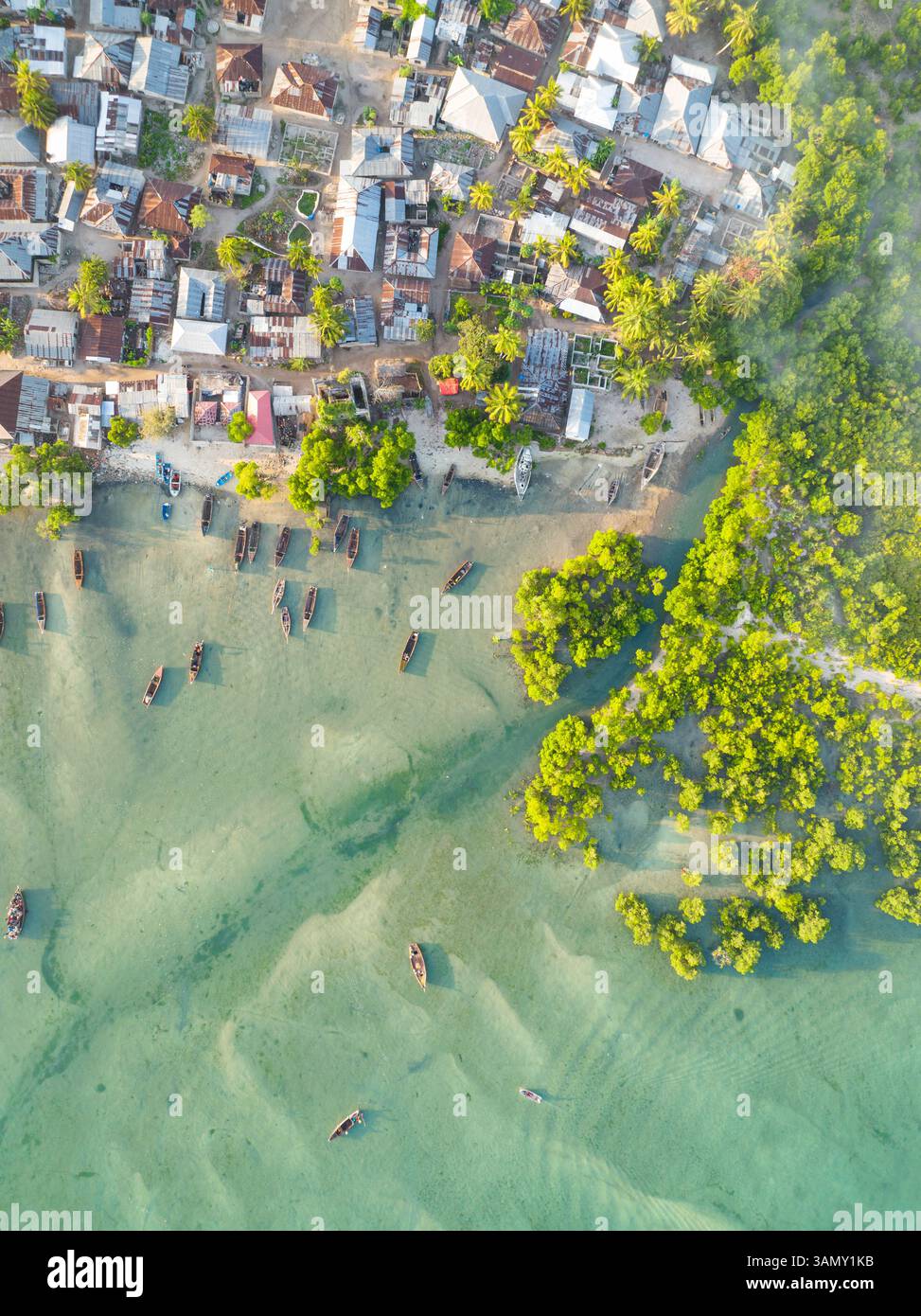 Aerial view of beautiful tropical village with sandy beach, turquoise ...