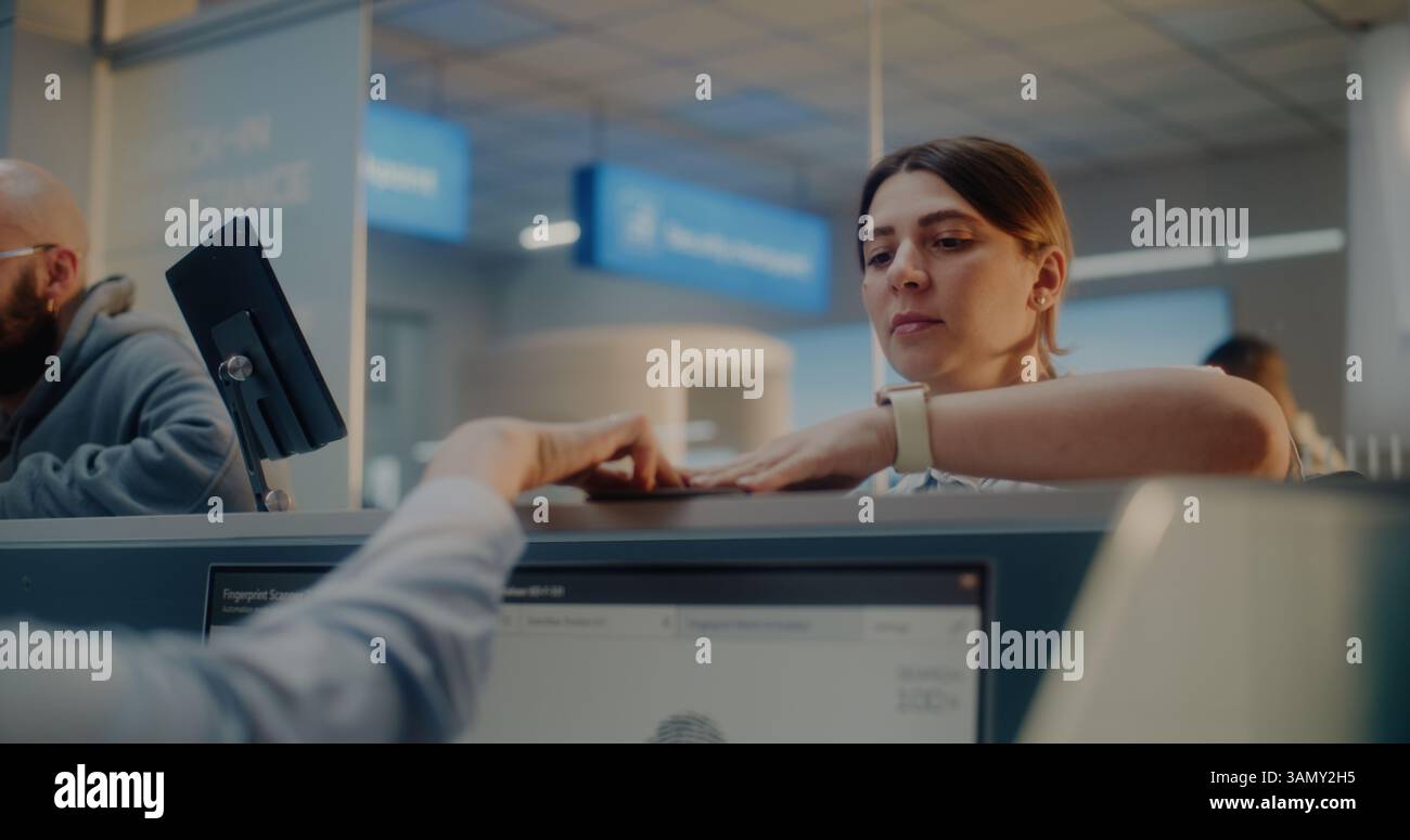 Airport Check-in Counter: Passenger Doing Fingerprint Scanning. Female ...