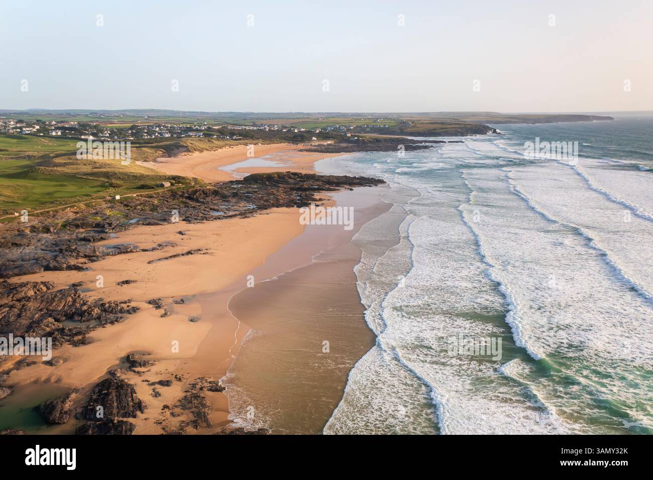 Aerial view of Constantine Bay and Boobies Bay during golden hour ...