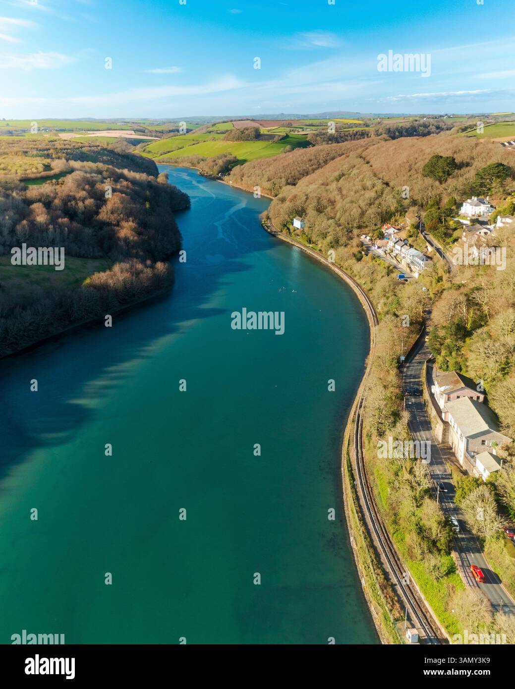 Aerial view of Looe River along side the railway line and countryside ...