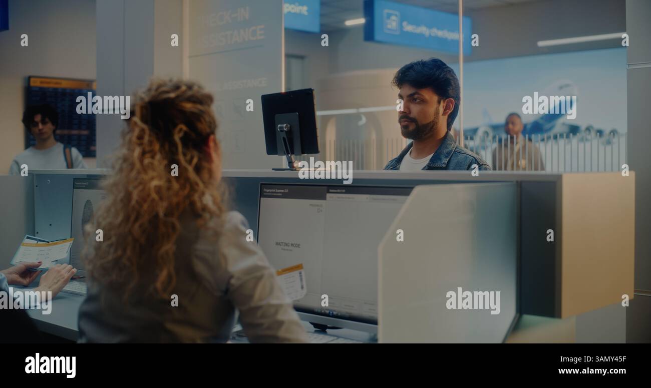 Airport Check-in Counter: Indian Man Verifying Personal ID Data by ...