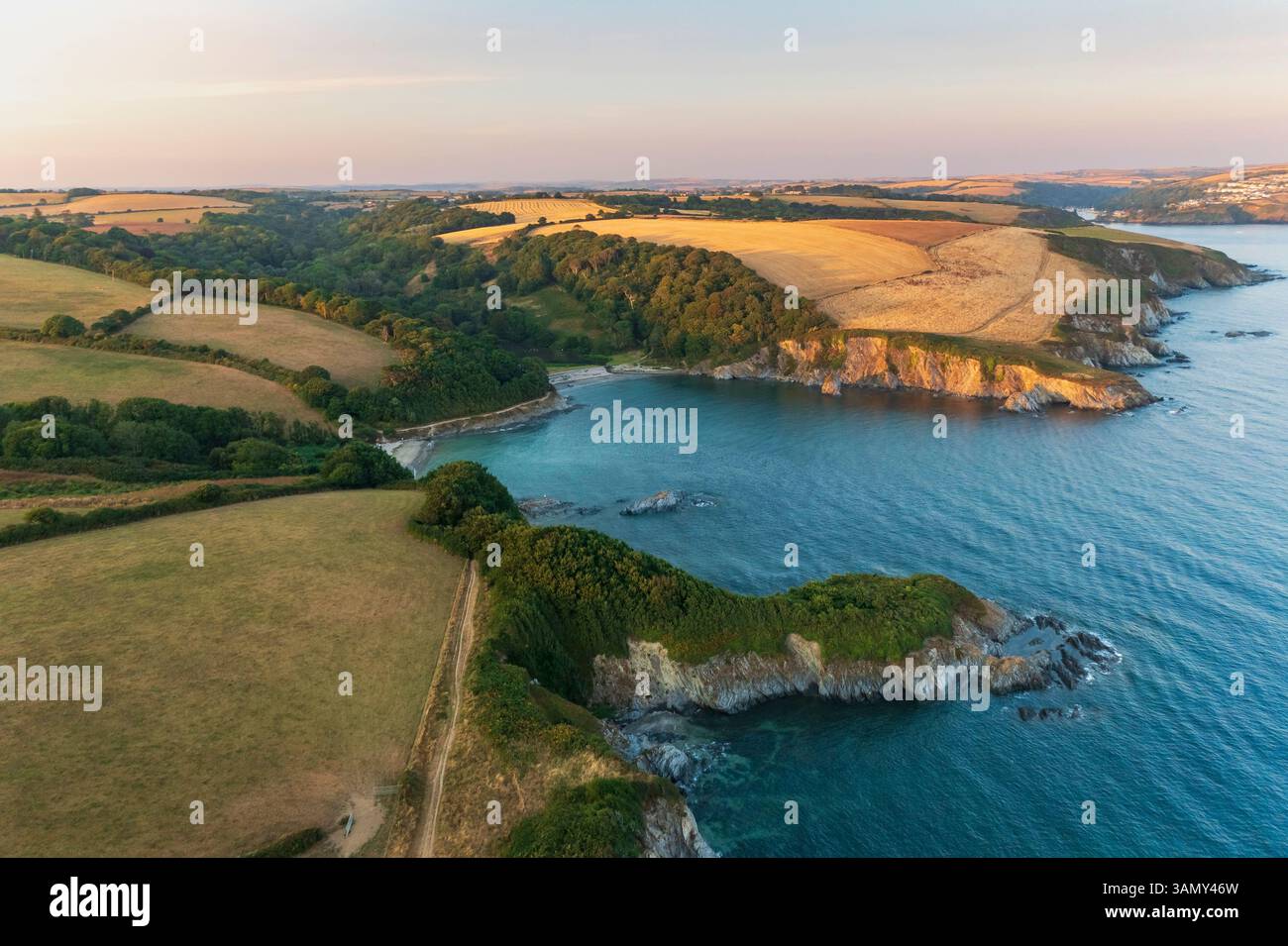 Aerial view of coastal path towards Polridmouth cove, Fowey and Polruan ...