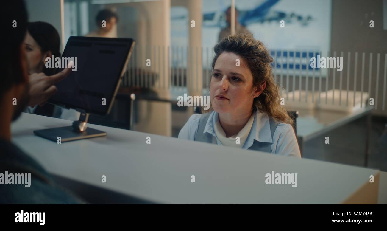 Airport Check-in Counter: Female Airline Agent Checking Traveler ...