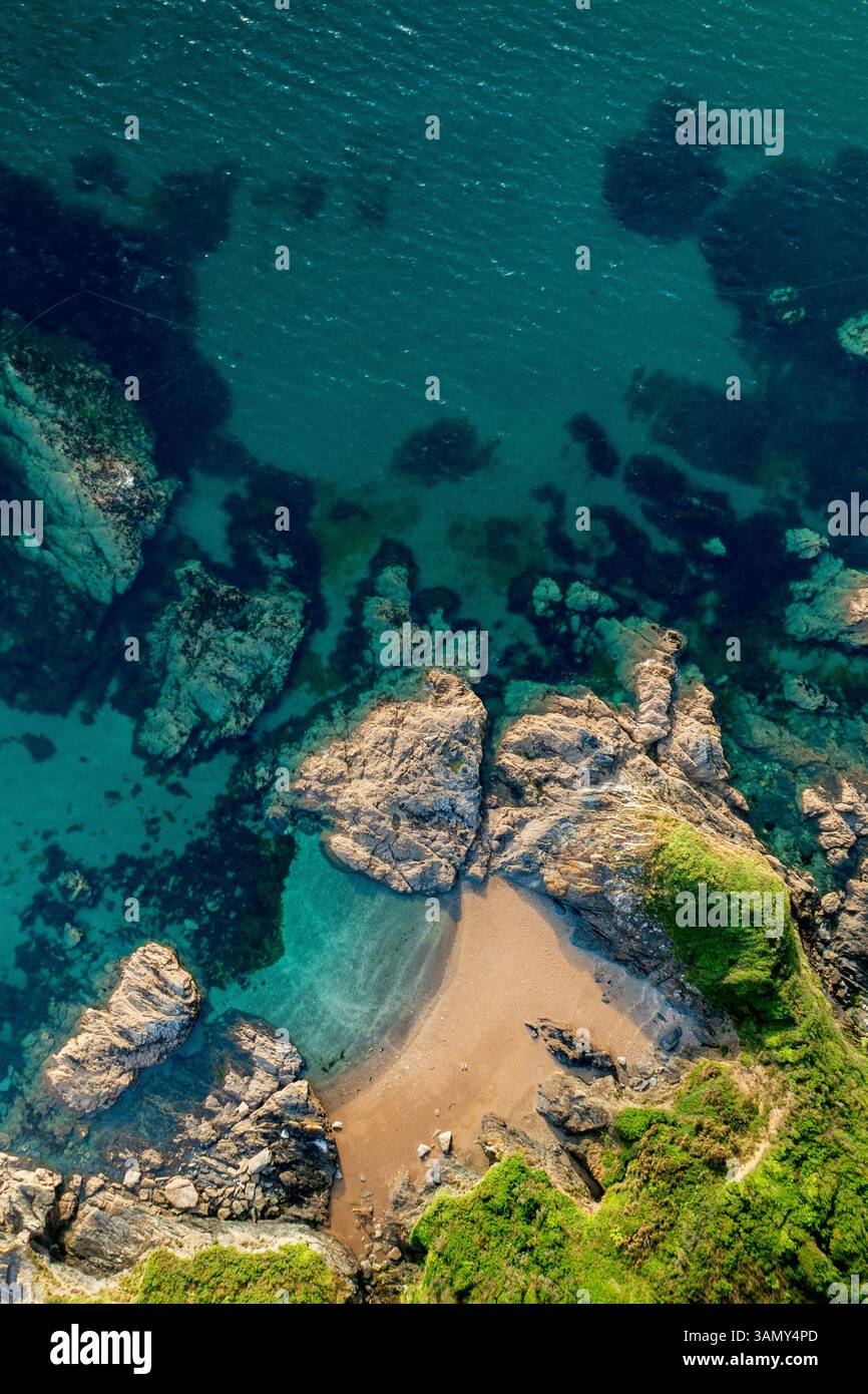 Aerial view of secret Cove at low tide with turquoise sea, from a ...