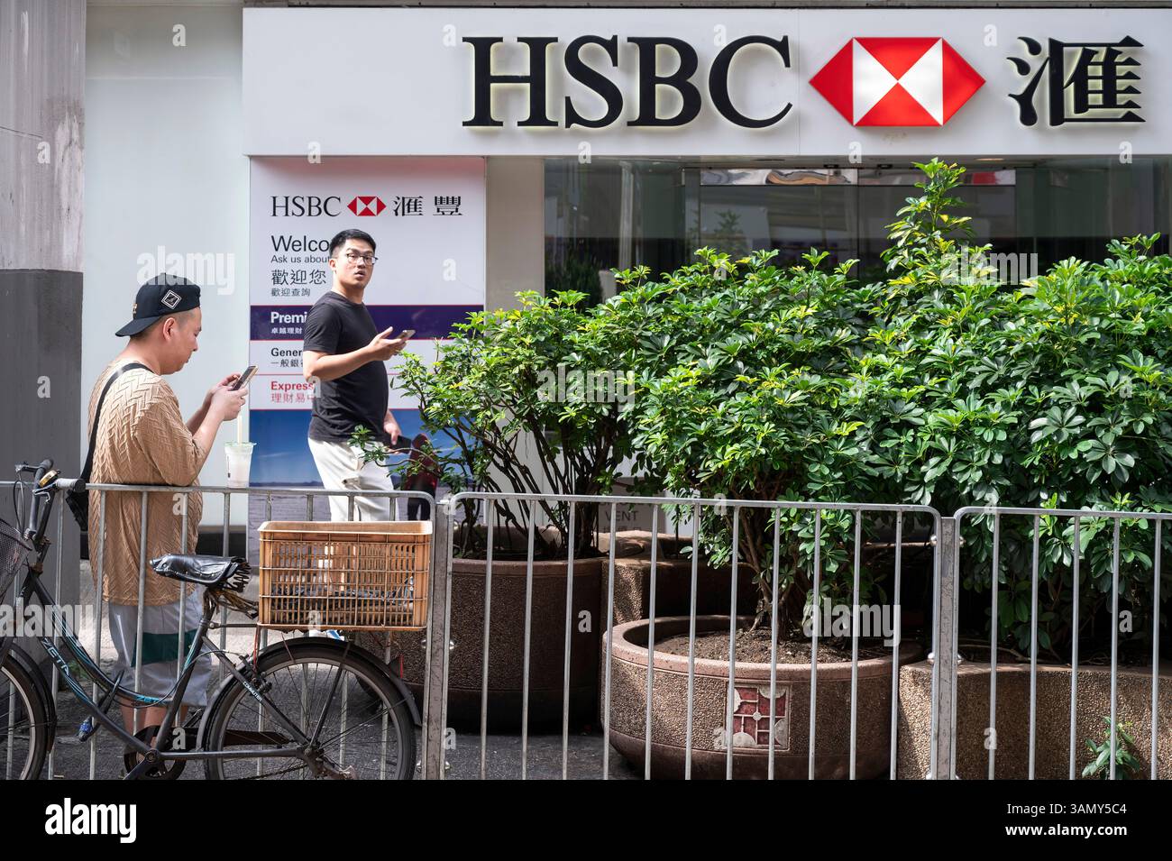 Hong Kong, China. 14th Apr, 2025. A pedestrian walks past the British ...