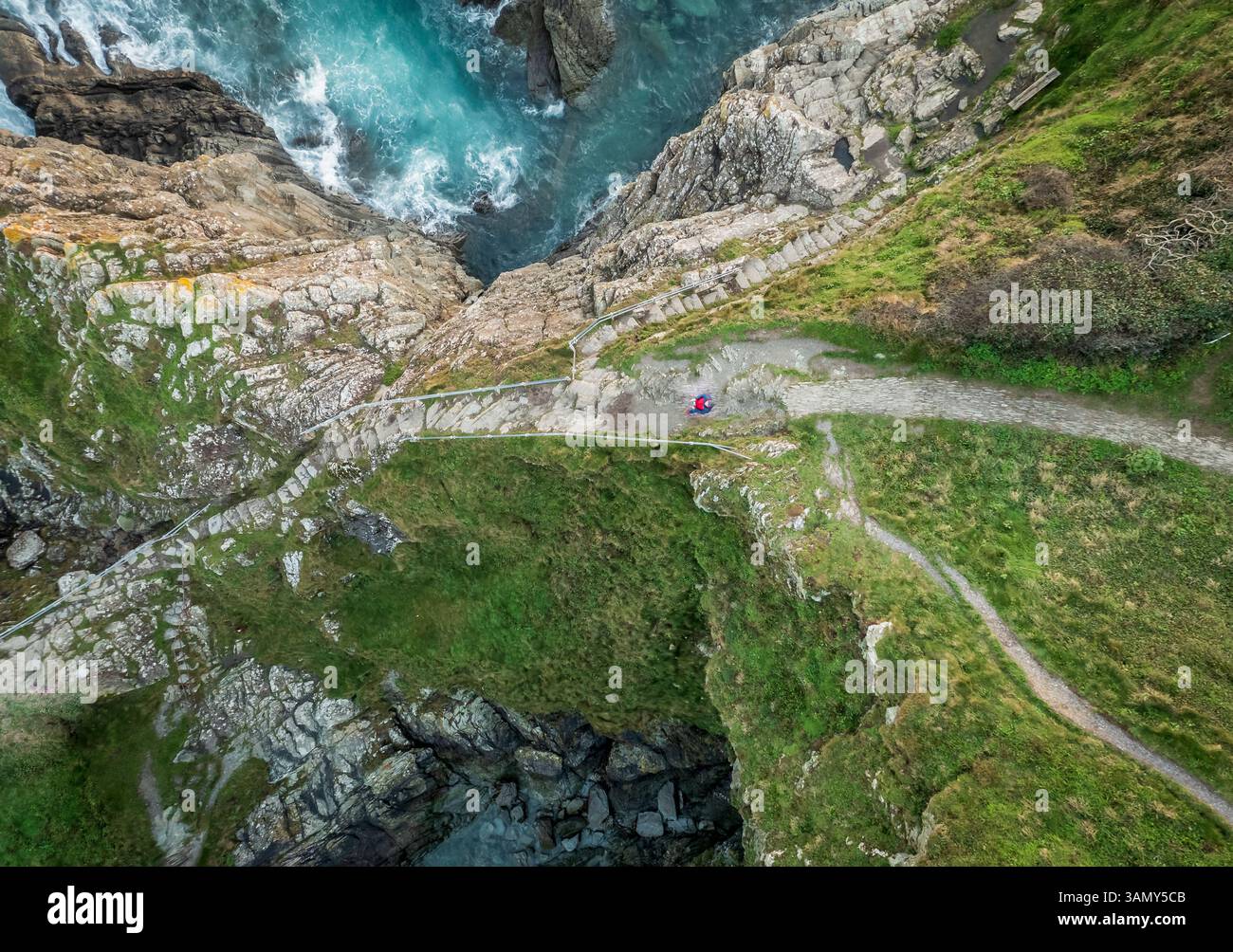 Aerial view of Polperro harbour entrance, topdown shot of steps leading ...