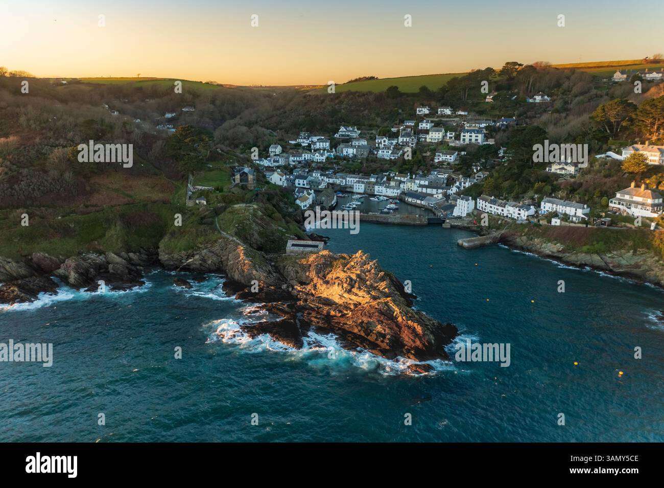 Aerial view of Polperro harbour at sunset, Cornwall, United Kingdom ...