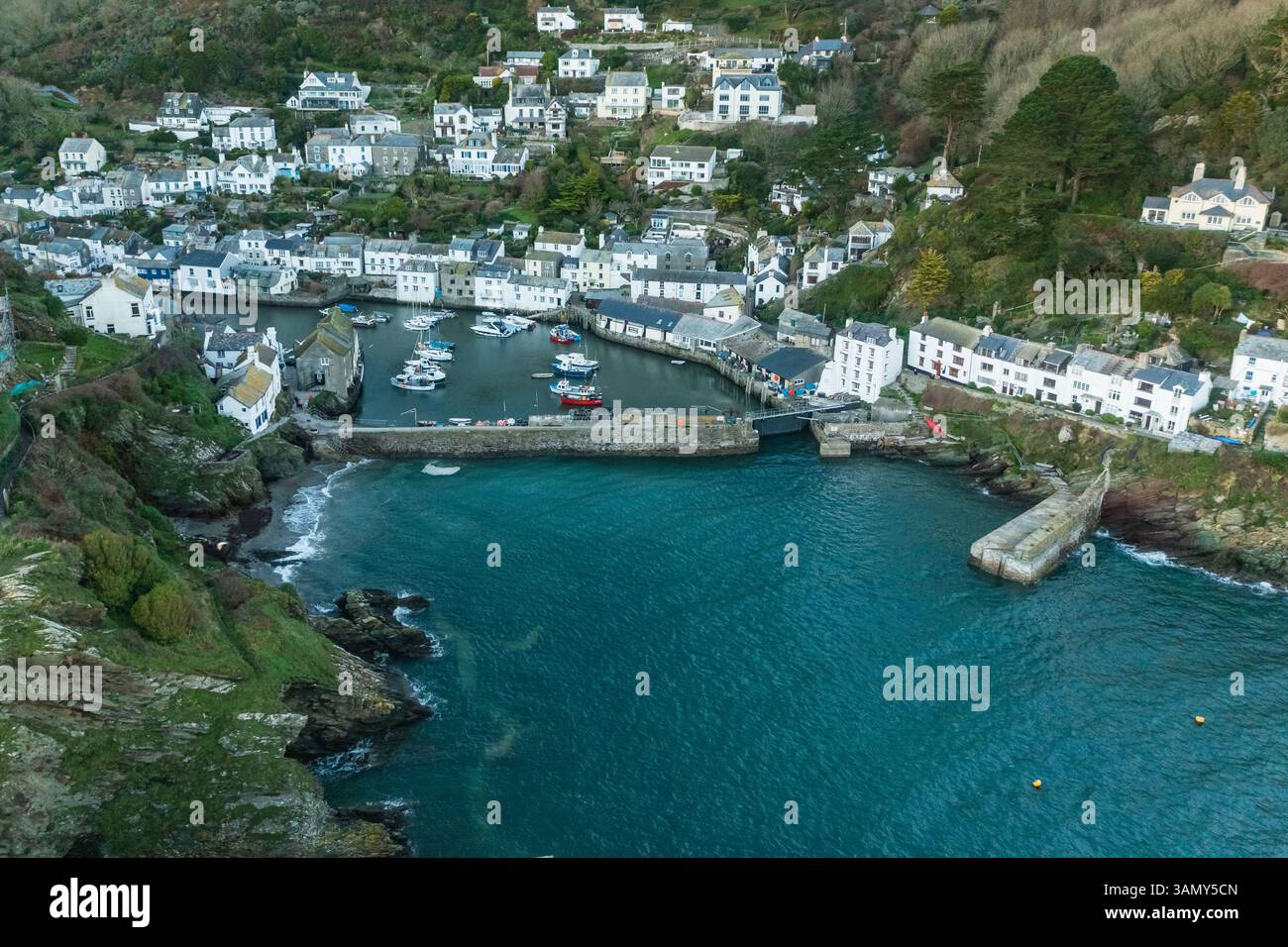 Aerial view of Polperro harbour at sunset, Cornwall, United Kingdom ...