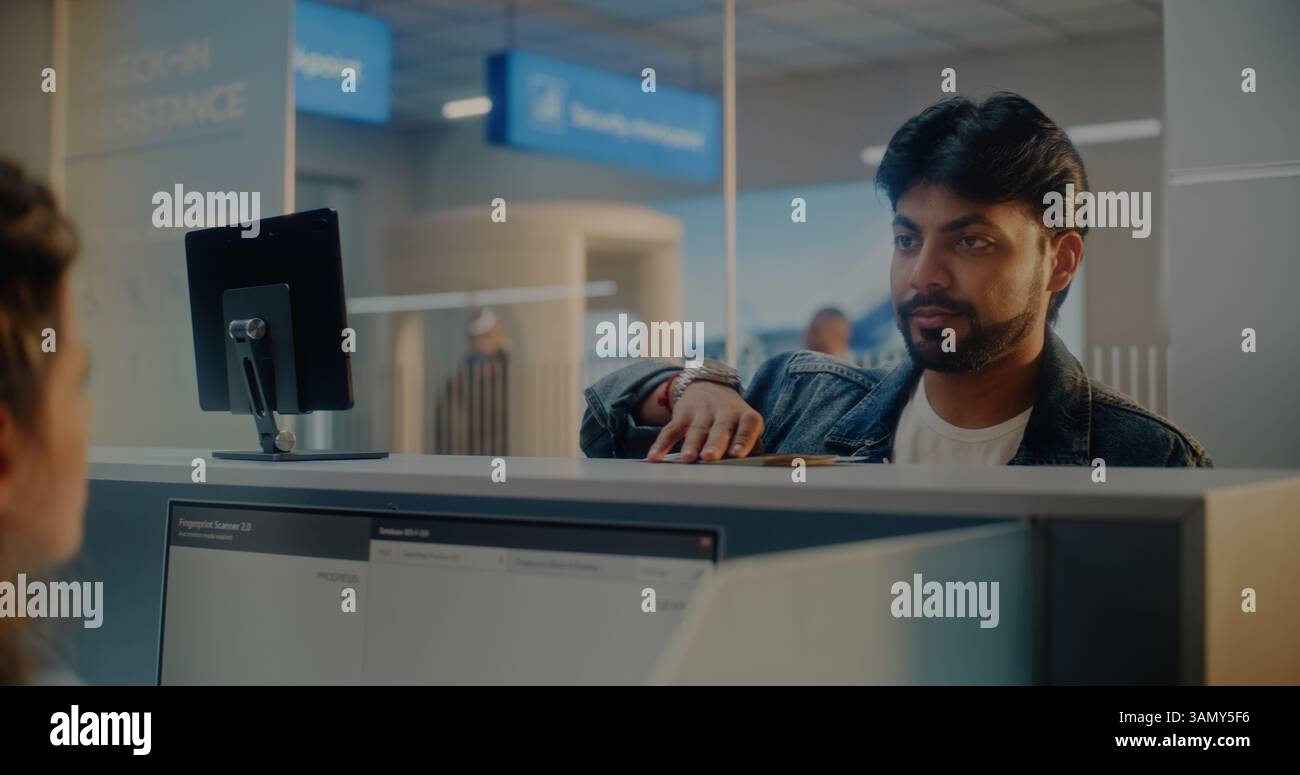 Airport Check-in Counter: Indian Man Verifying Personal ID Data by ...