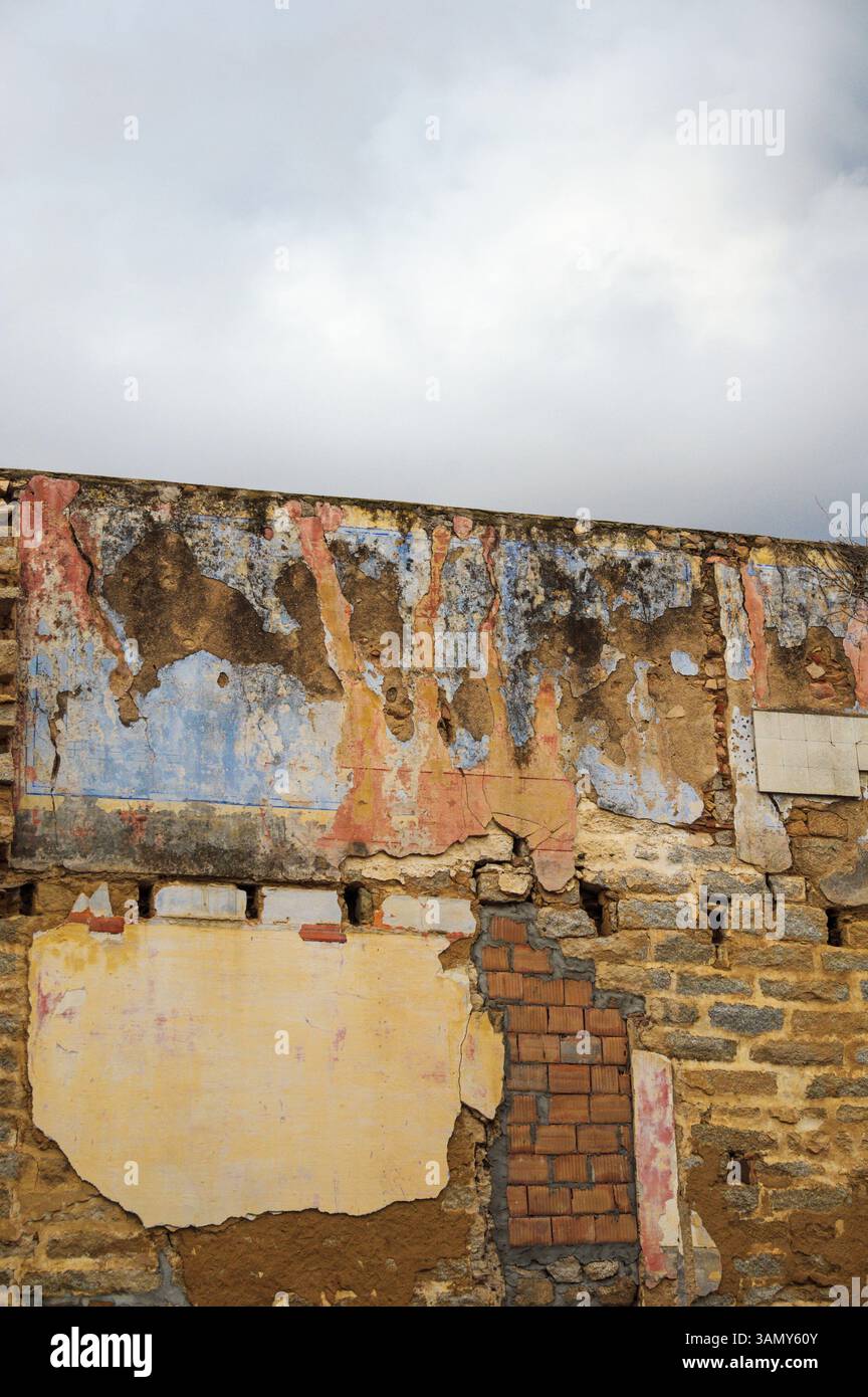 old scraped brick wall under a cloudy sky Stock Photo - Alamy
