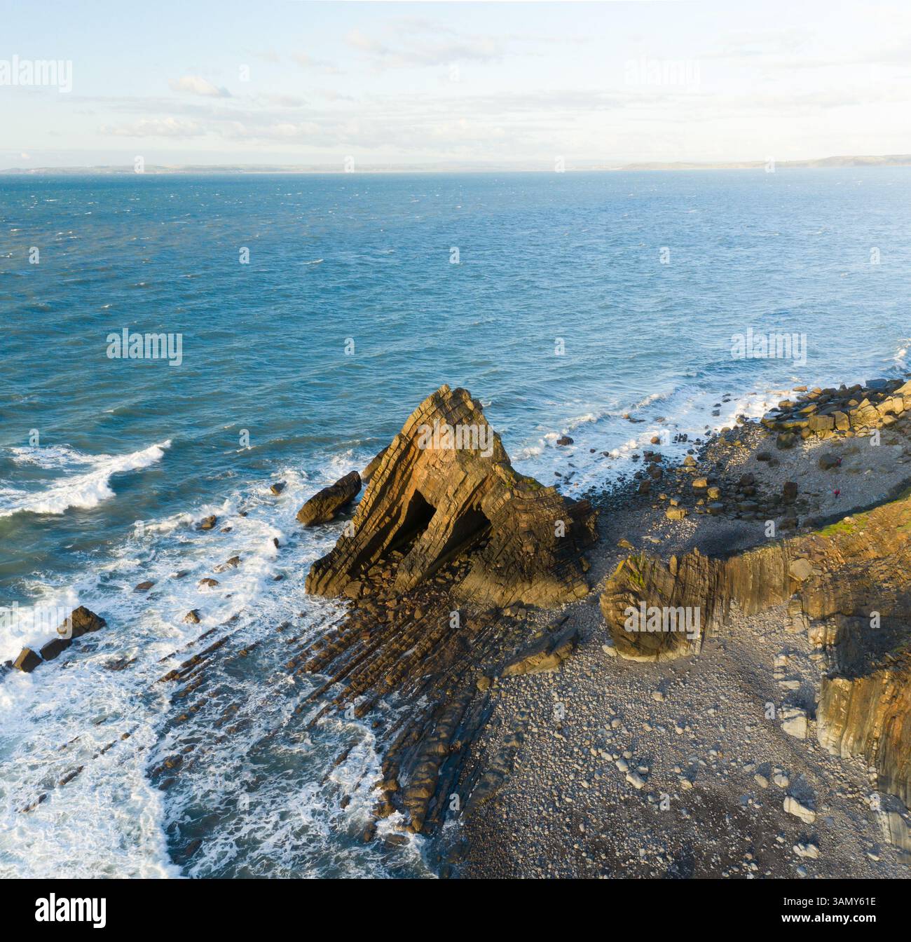 Aerial view of Black Church Rock at sunset, Mouthmill Beach, Hartland ...