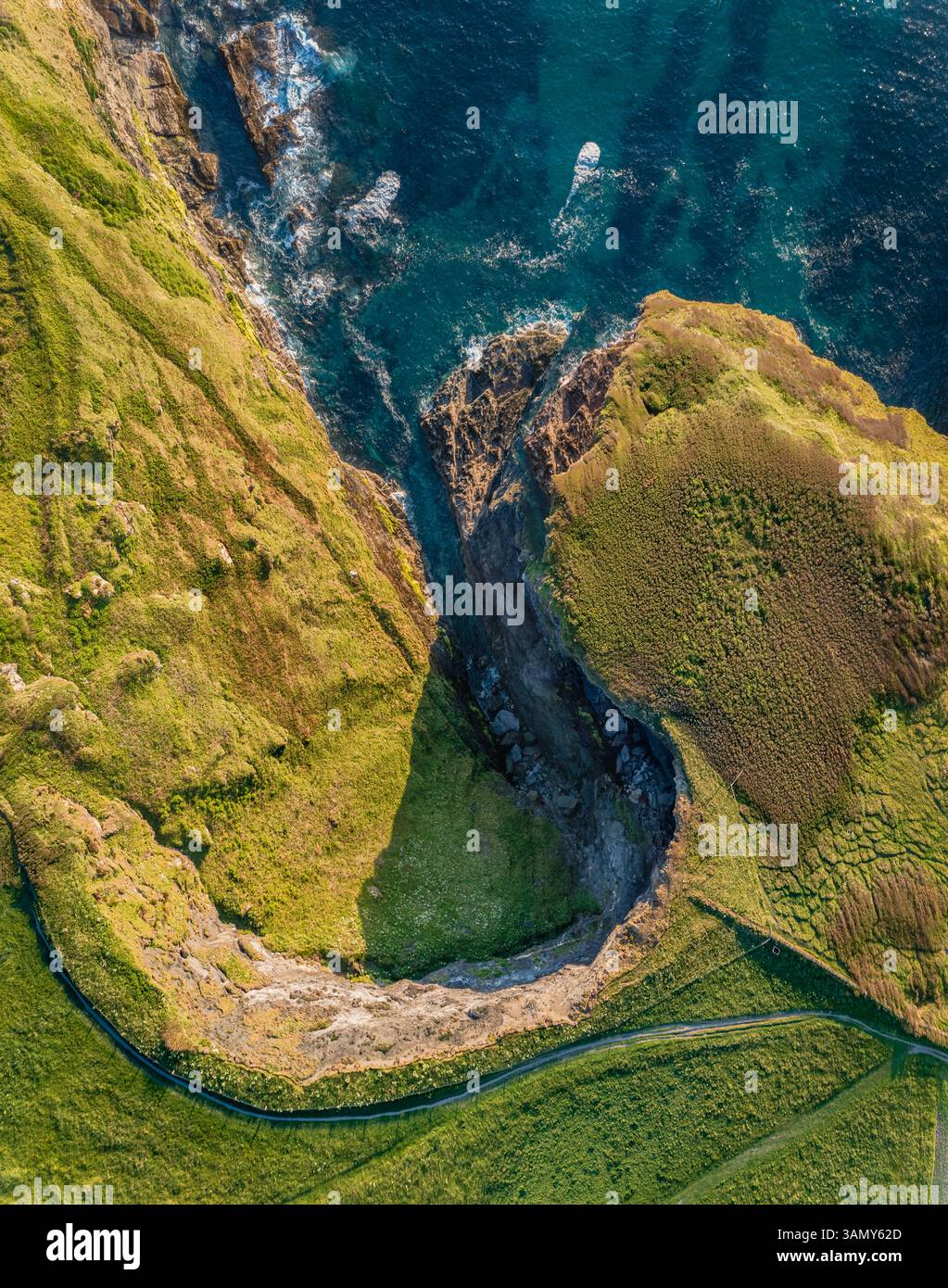 Aerial view of Boscatle at sunset, along the coastal path, Cornwall ...