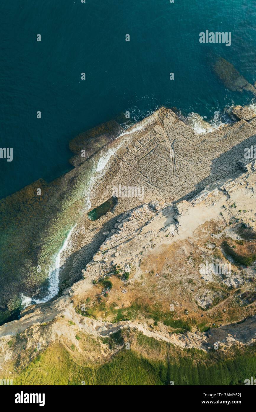 Aerial view of Dancing Ledge, a wild coastline along the sea in National Trust Worth Matravers ...