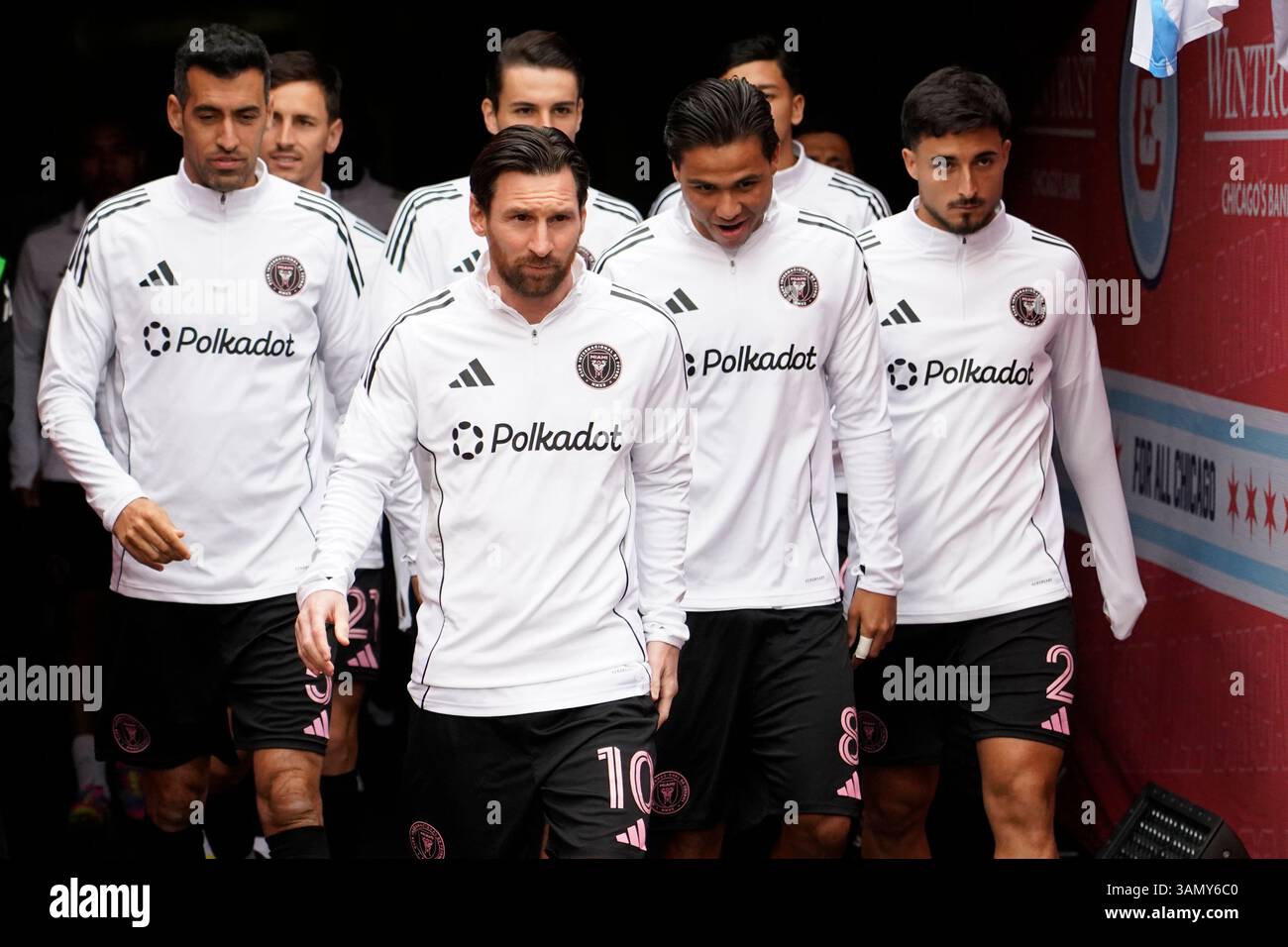 Inter Miami forward Lionel Messi, center, enters the field with his ...