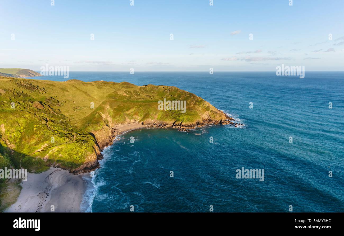 Aerial view of Lantic Bay, a secret coves along the coast at sunset ...