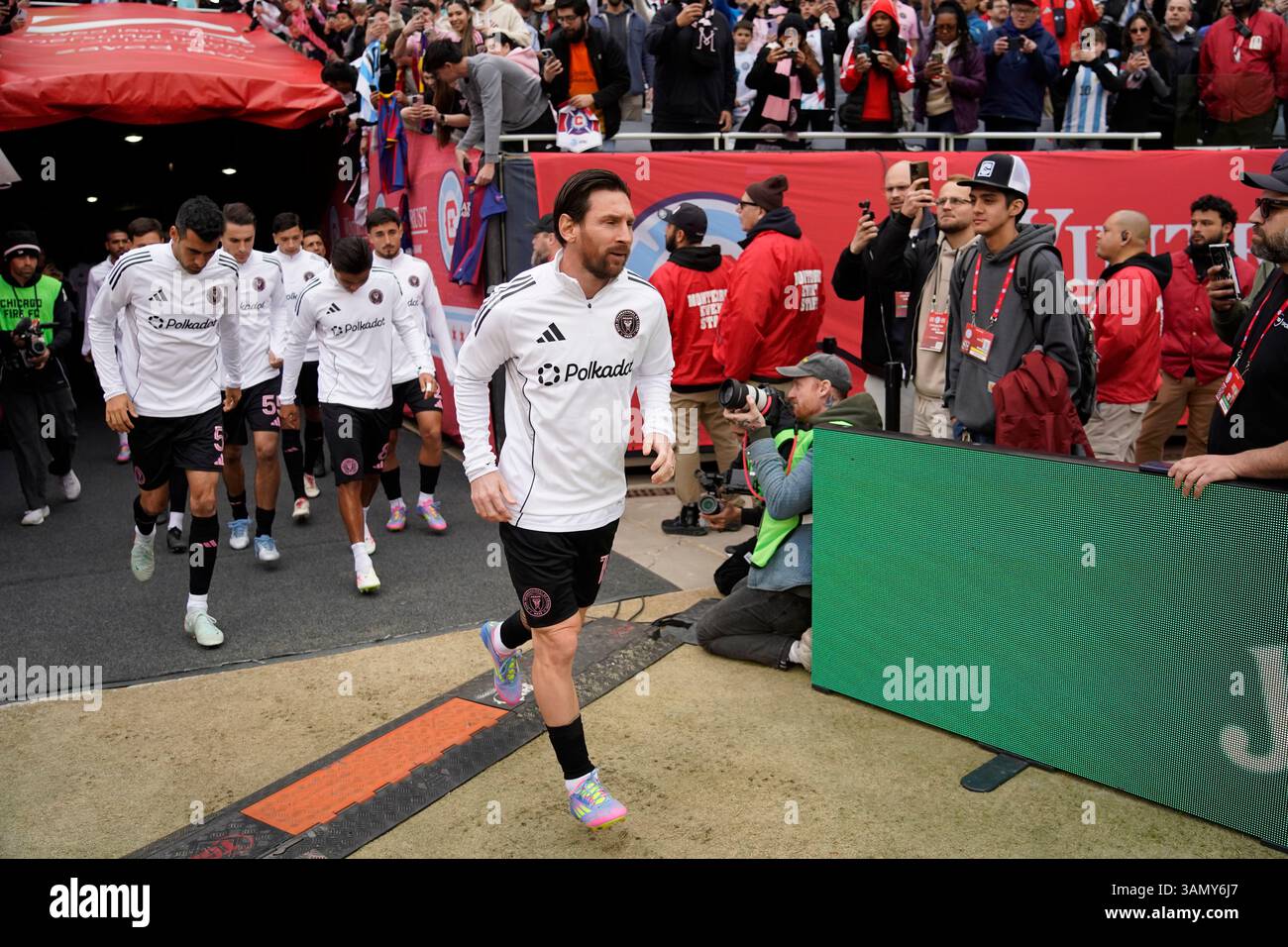 Inter Miami forward Lionel Messi, center, enters the field with his ...
