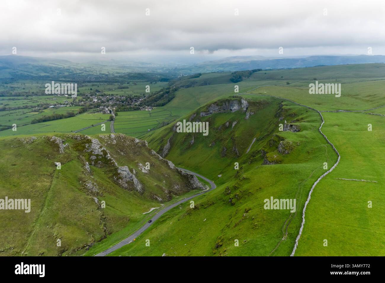 Aerial view of a winding road driving through Winnats Pass in Peak ...