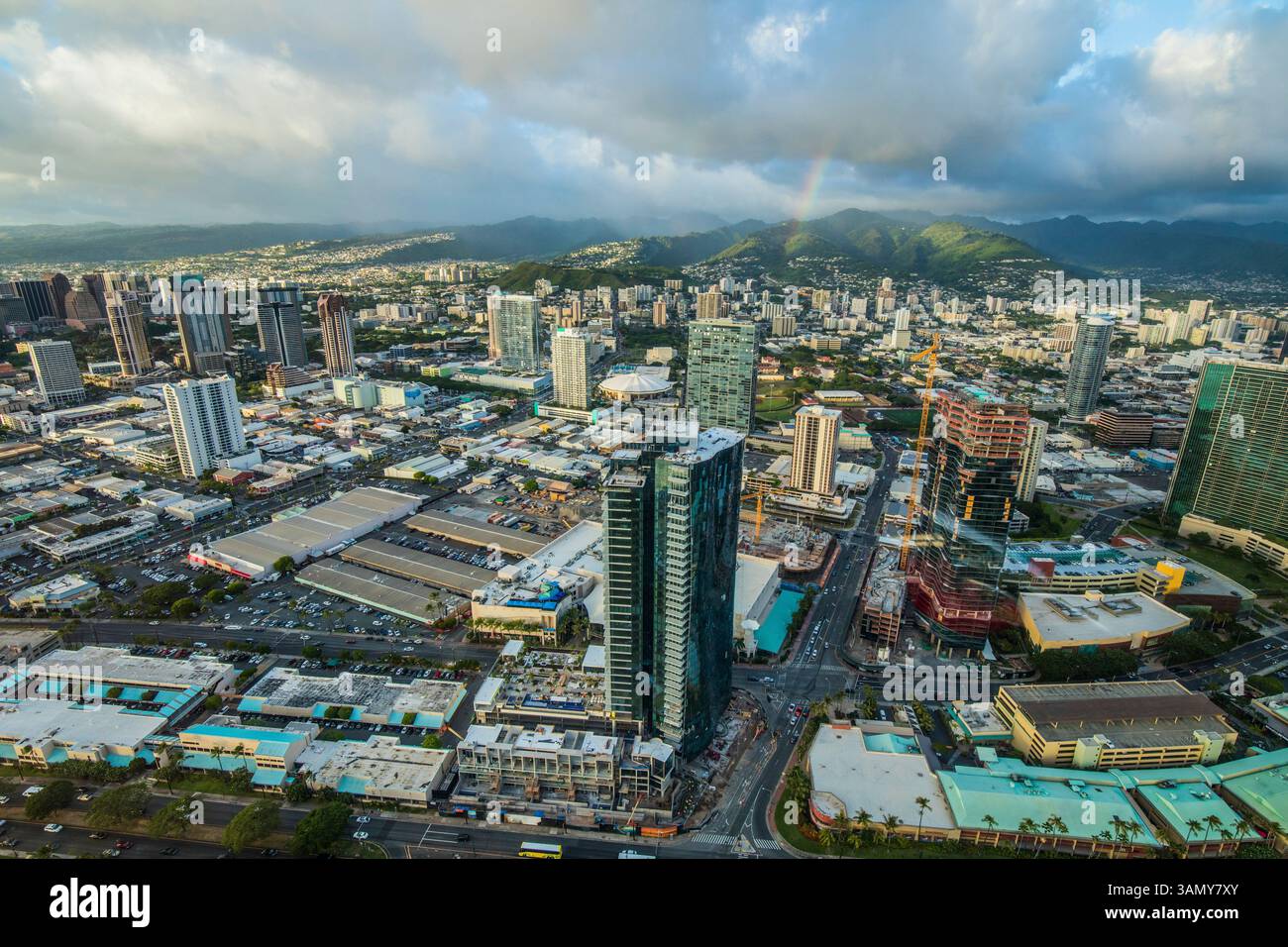 Aerial view of vibrant Honolulu skyline with tropical mountains and ...