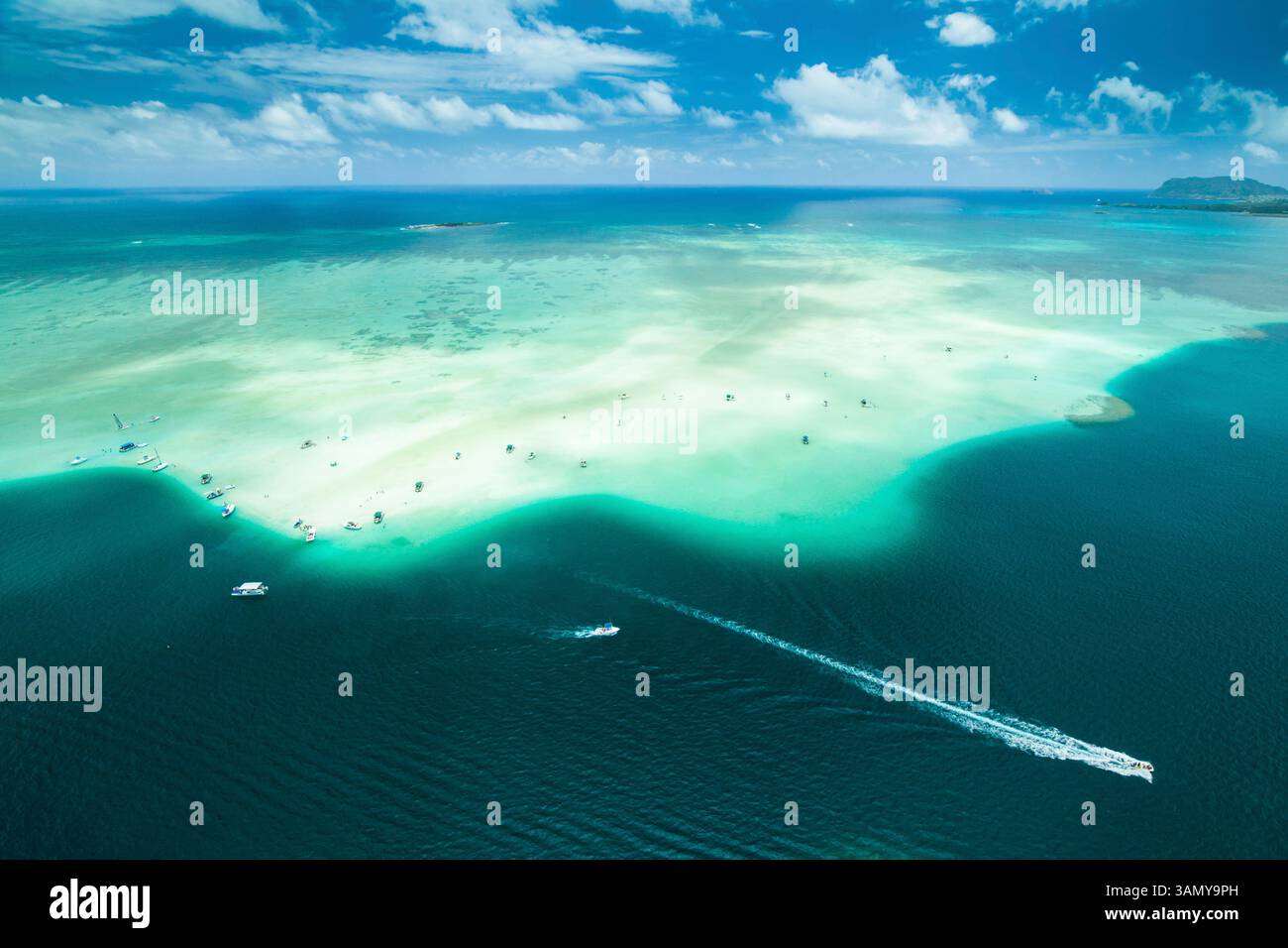 Aerial view of Sandbar Cruiser, boats, clear water, and sky, Hawaii ...
