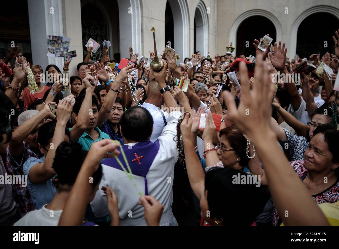 Catholic priest sprinkles holy water hi-res stock photography and ...