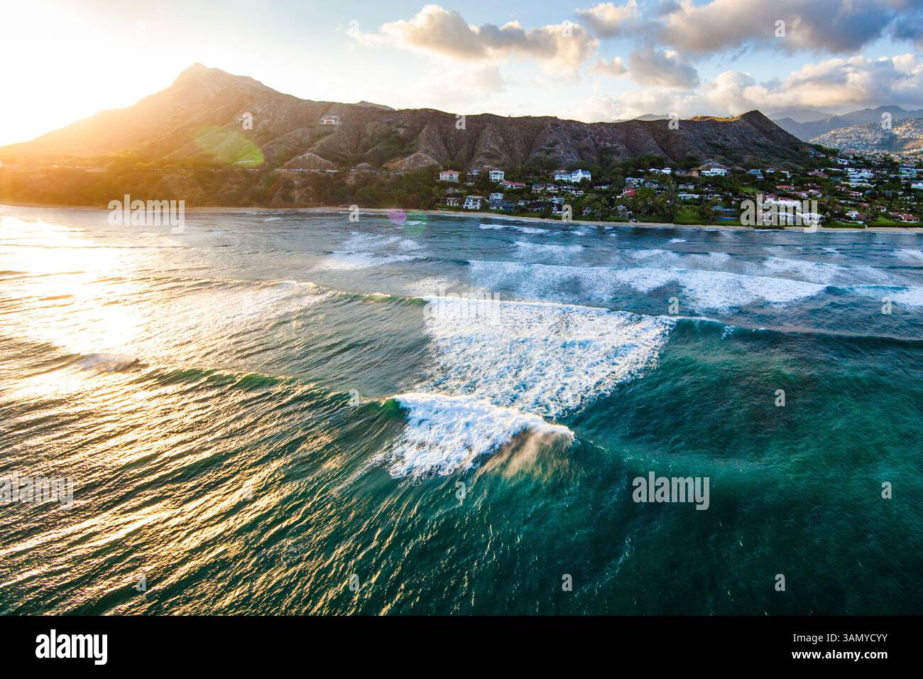 Aerial view of Diamond Head volcano with waves and mountains, Hawaii ...