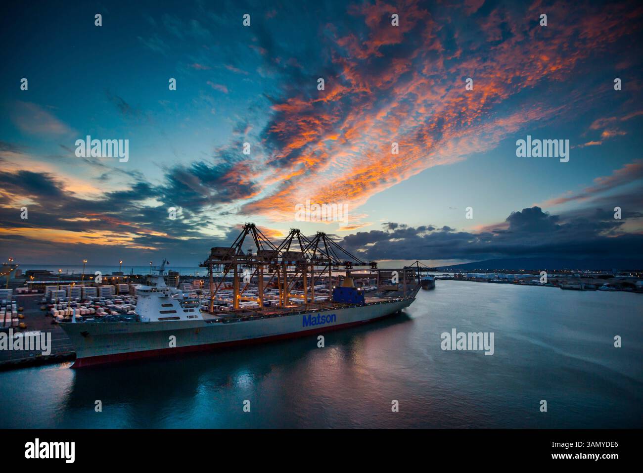 Aerial view of industrial harbour with container ship at dusk, Honolulu ...