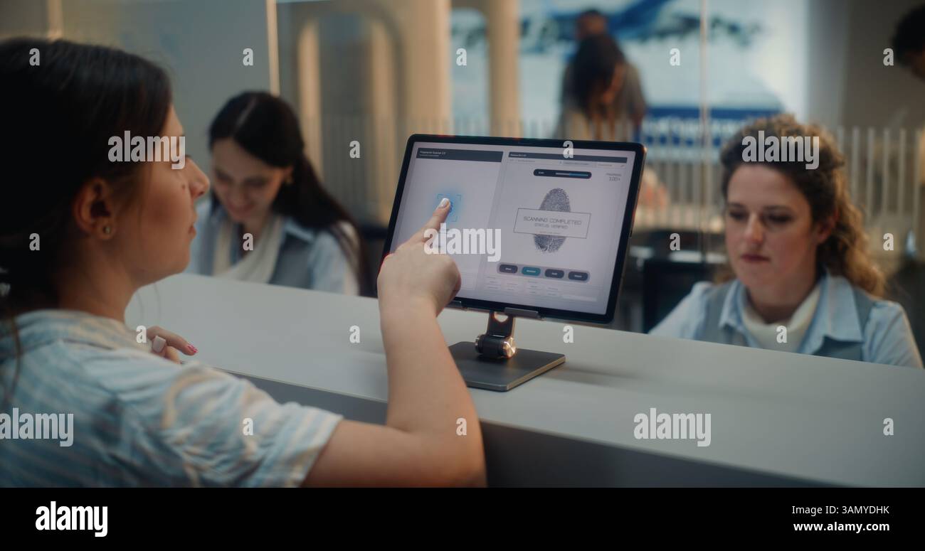 Airport Check-in Counter: Female Airline Agent Checks Passenger ...