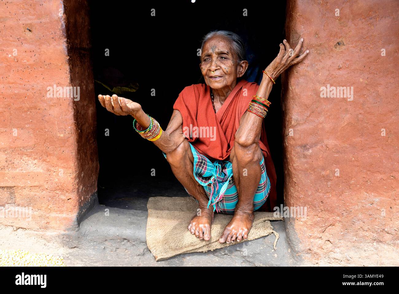 Old woman decorated with nose rings and jewelry and dressed in ...