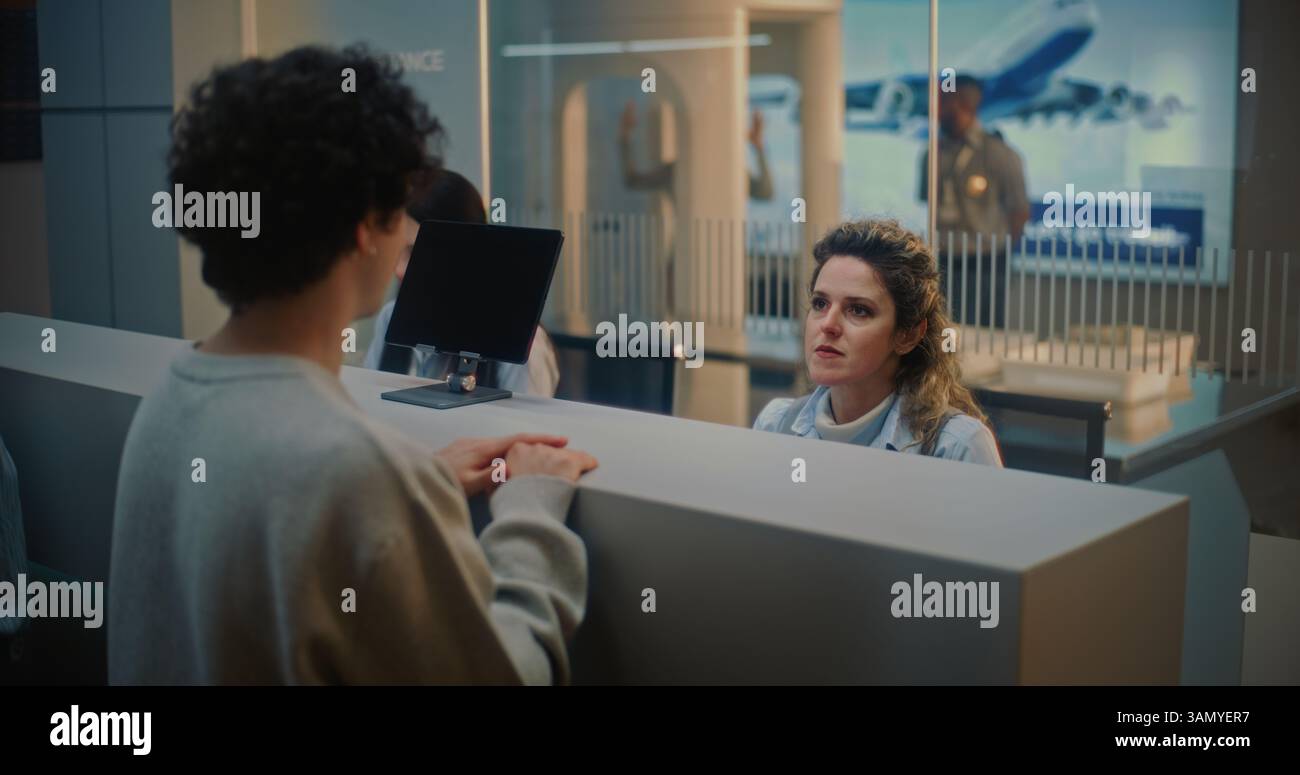 Airport Check-in Counter in International Airport Terminal: Female ...