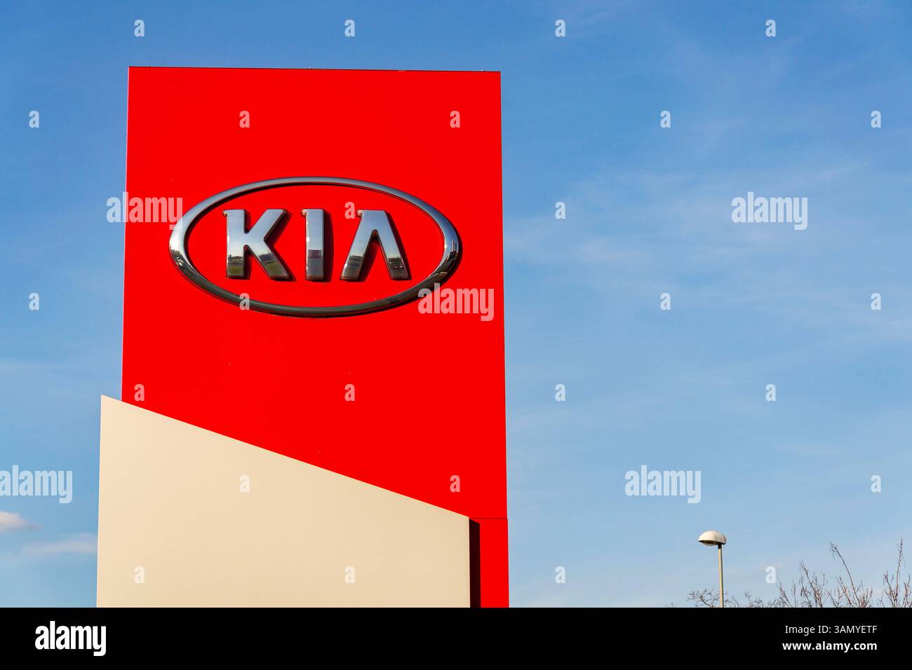 Kia motors company logo in front of dealership building on April 12 ...