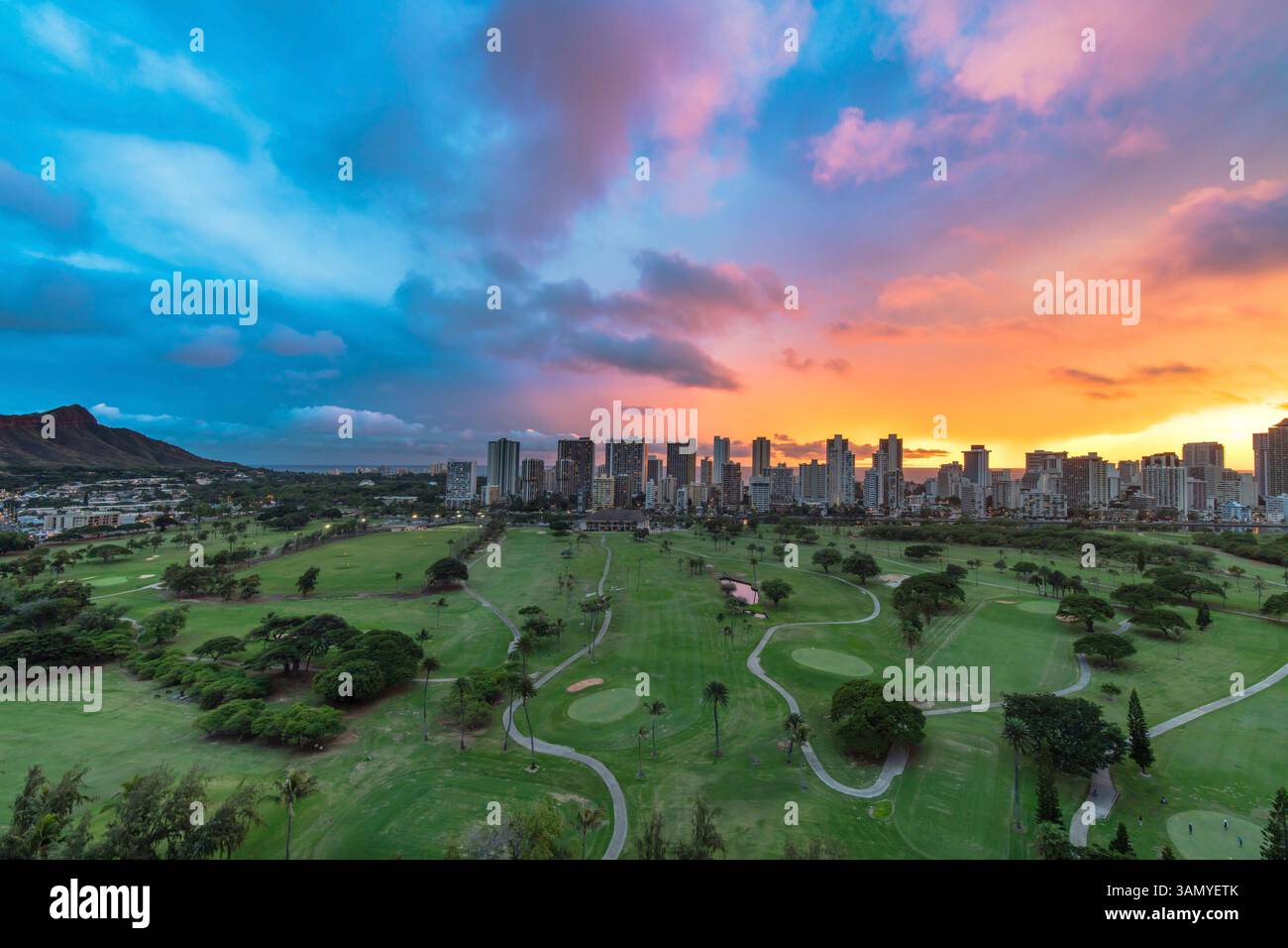 Aerial view of Honolulu skyline at sunset with golf course and Shave ...