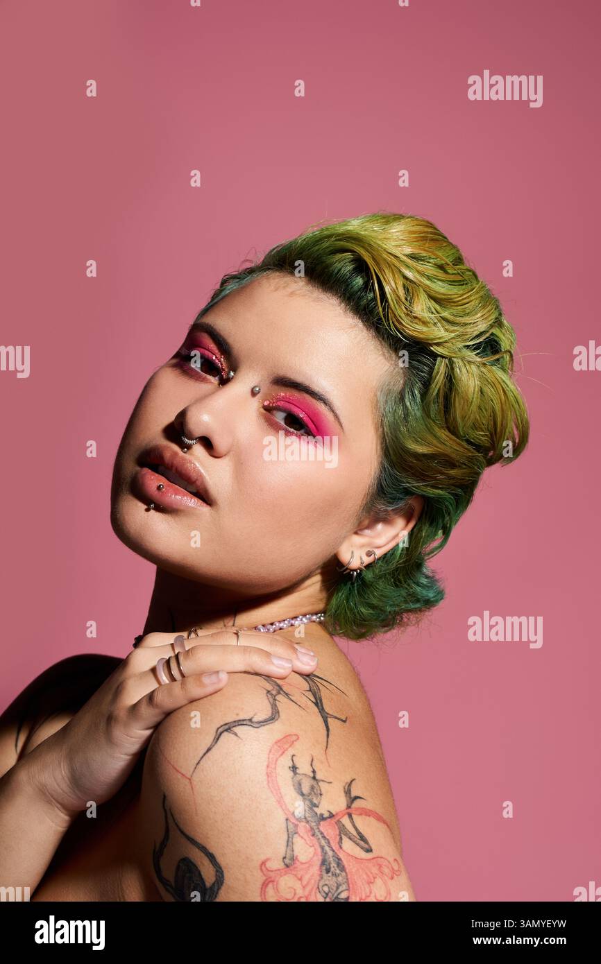 A stylish young woman poses elegantly with vibrant makeup and an ...