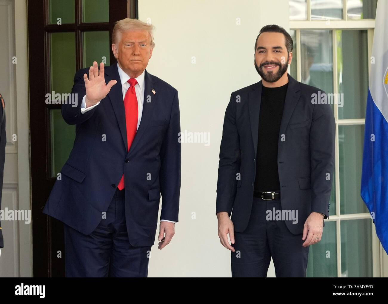 President Donald Trump, left, waves as he greets El Salvador's ...