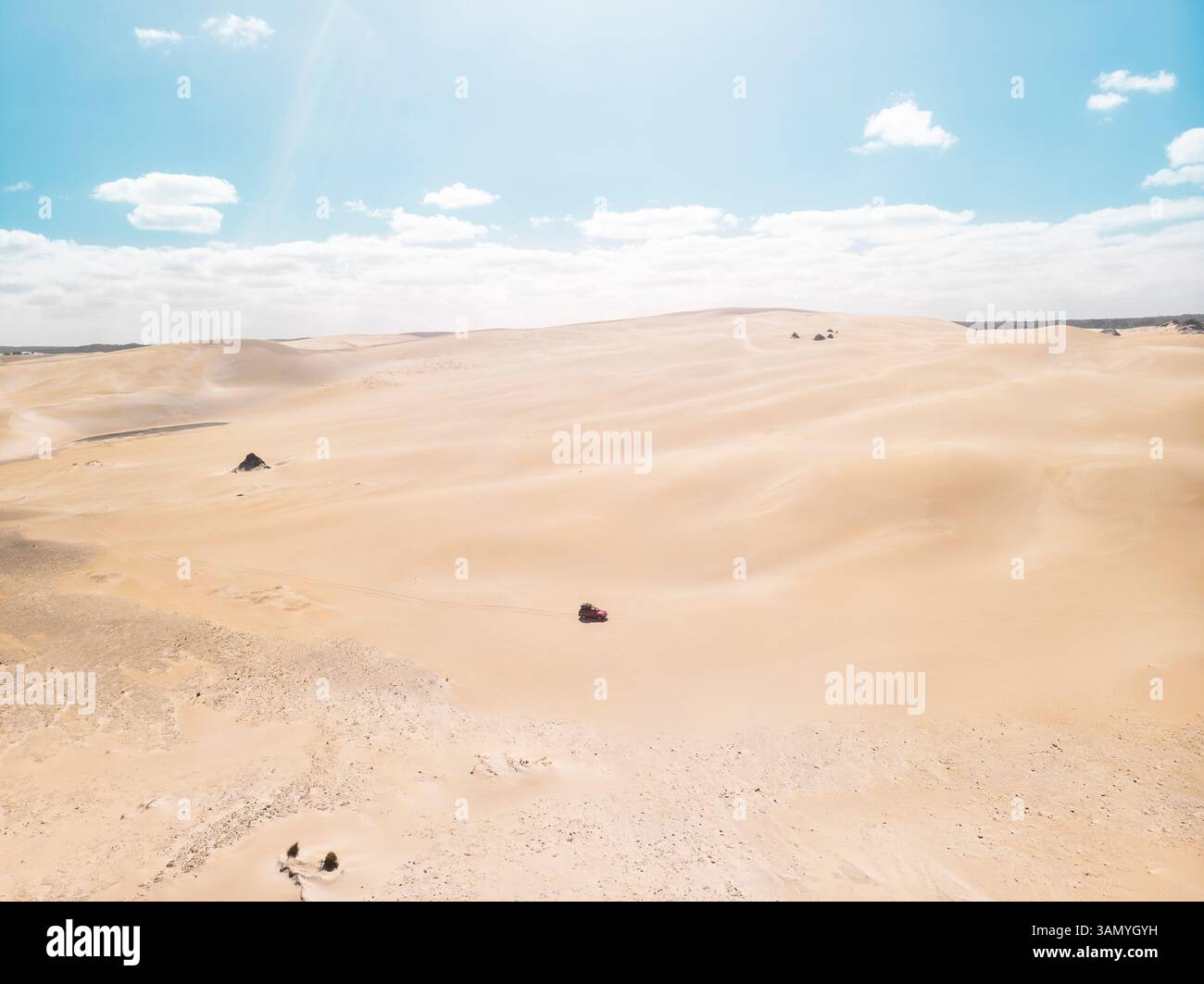 Aerial view of a car driving on sand dunes in Port Lincoln National ...
