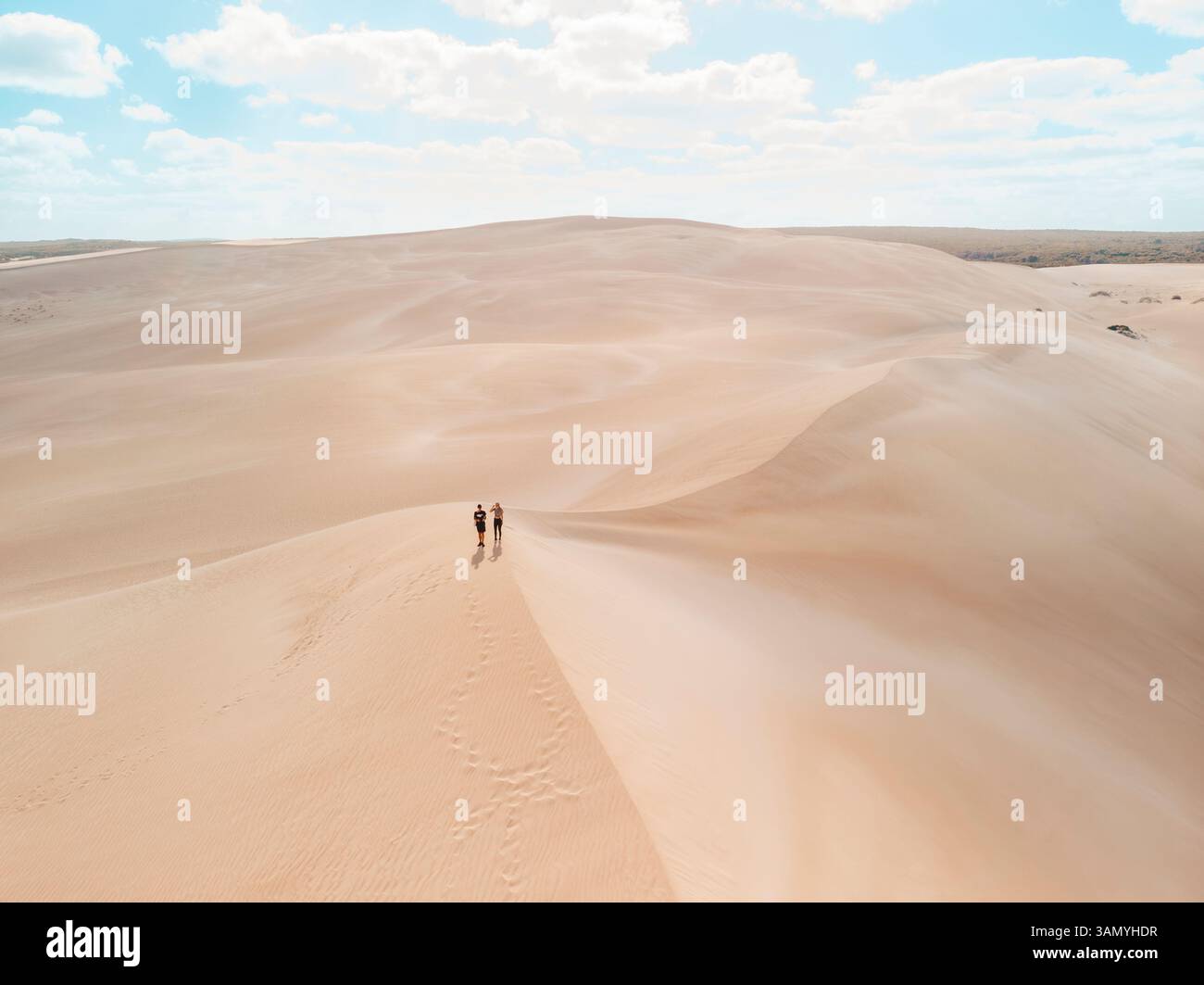 Aerial view of two people standing on a sand dunes in Port Lincoln ...