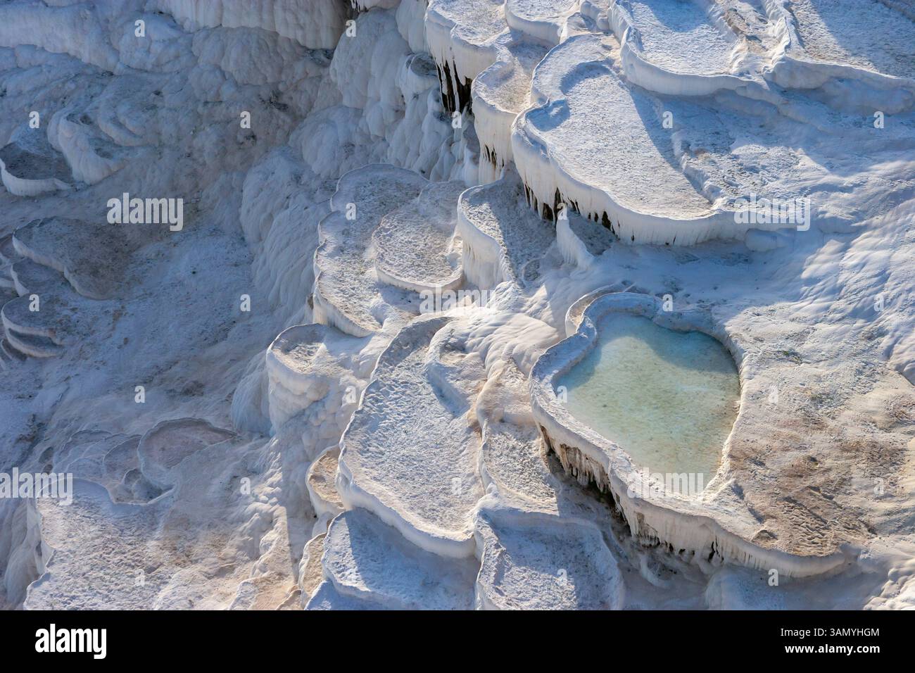 Aerial view of beautiful travertine terraces and thermal water pools ...
