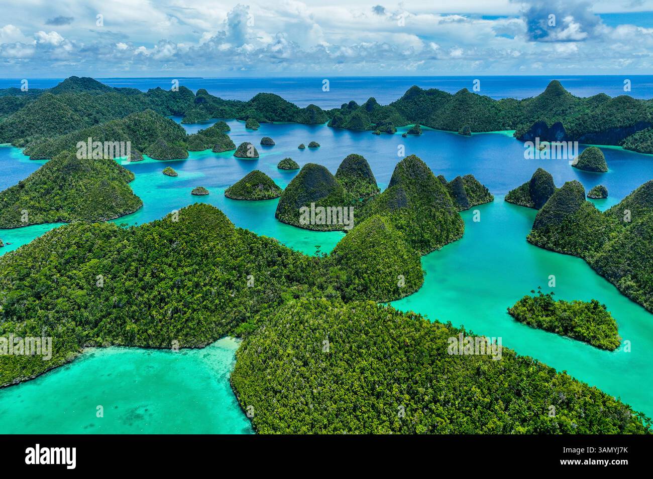 Aerial view of tropical islands with lush greenery and blue water in ...