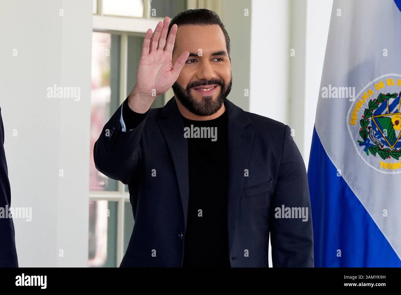 El Salvador's President Nayib Bukele waves as he arrives and is greeted ...