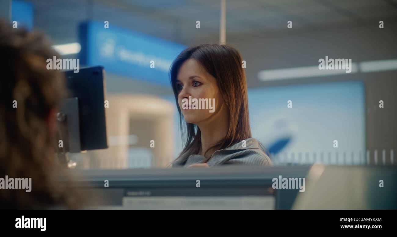 Airport Check-in Counter: Woman Verifying Biometric Data by Facial ...