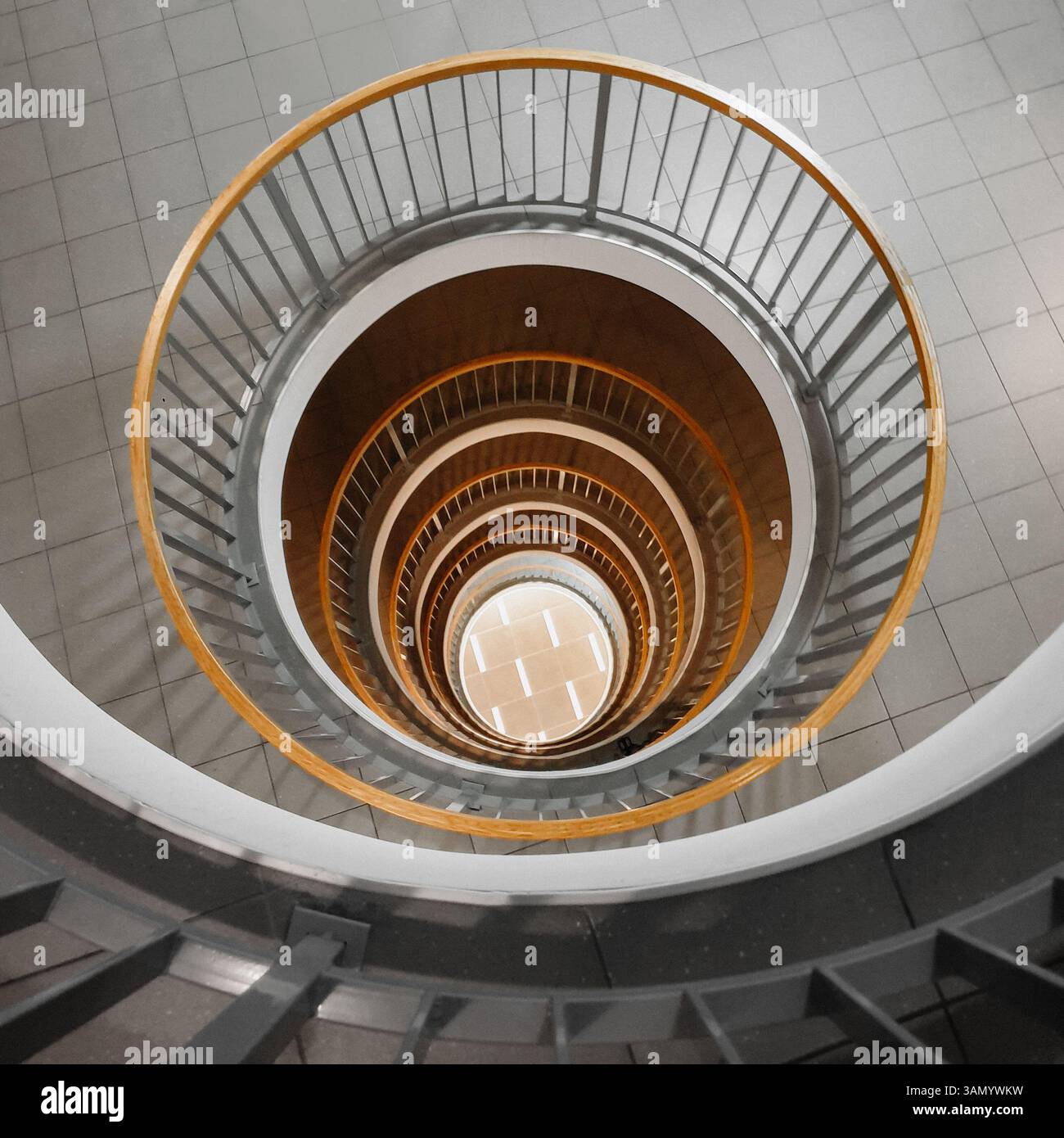 Round light well inside residential building. Looking down through ...