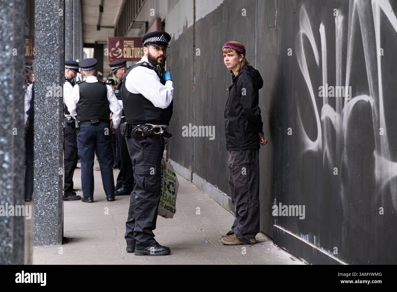 London, UK. 14th Apr, 2025. A female pro-Palestine protestor is seen ...