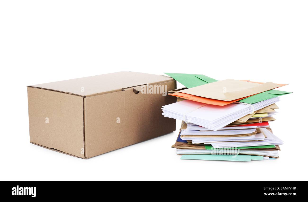 Stack of different paper envelopes and parcel on white background. Post ...