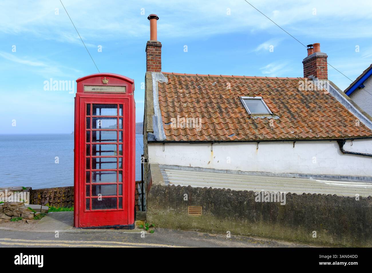 12 April 2025 - Runswick Bay, UK - A traditional British Red Telephone ...