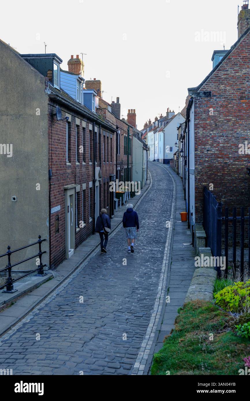 12 April 2025 - Whitby UK - A small istoric courtyard, alley way with ...