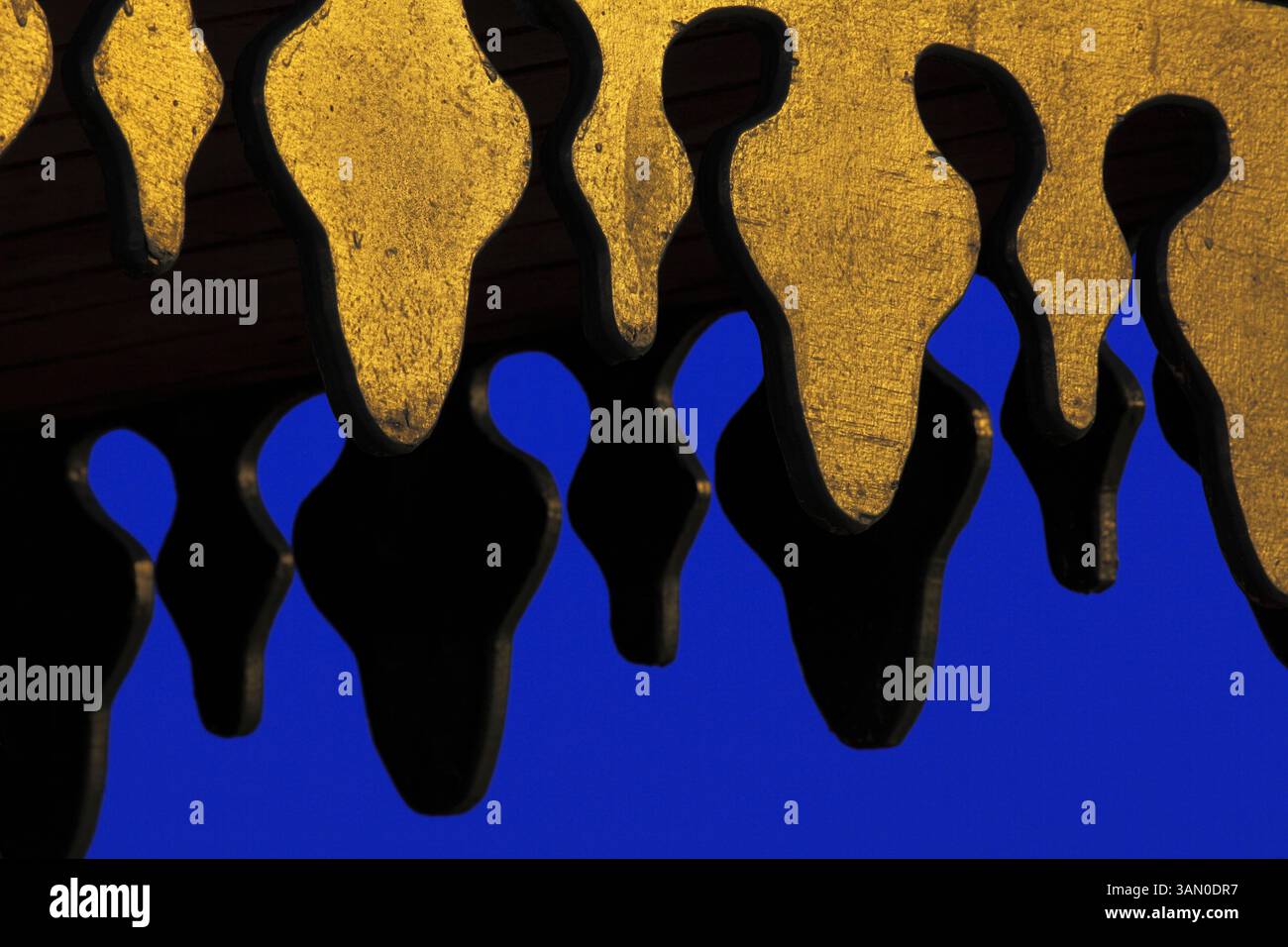 Intricate wooden 'dripping' fascia on overhanging eaves on a seafront ...