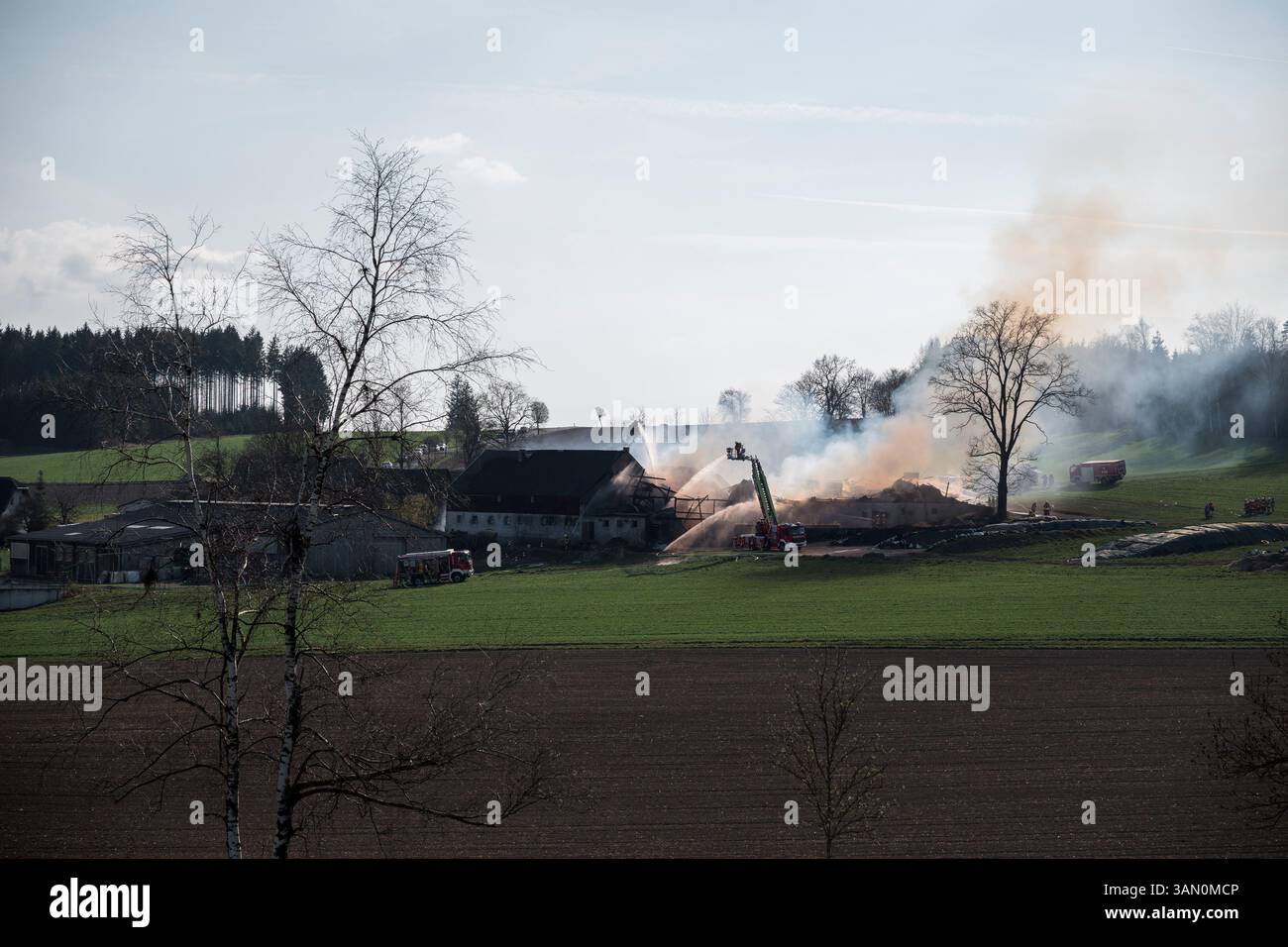 Helmbrechts, Germany. 14th Apr, 2025. Firefighters extinguish the fire ...
