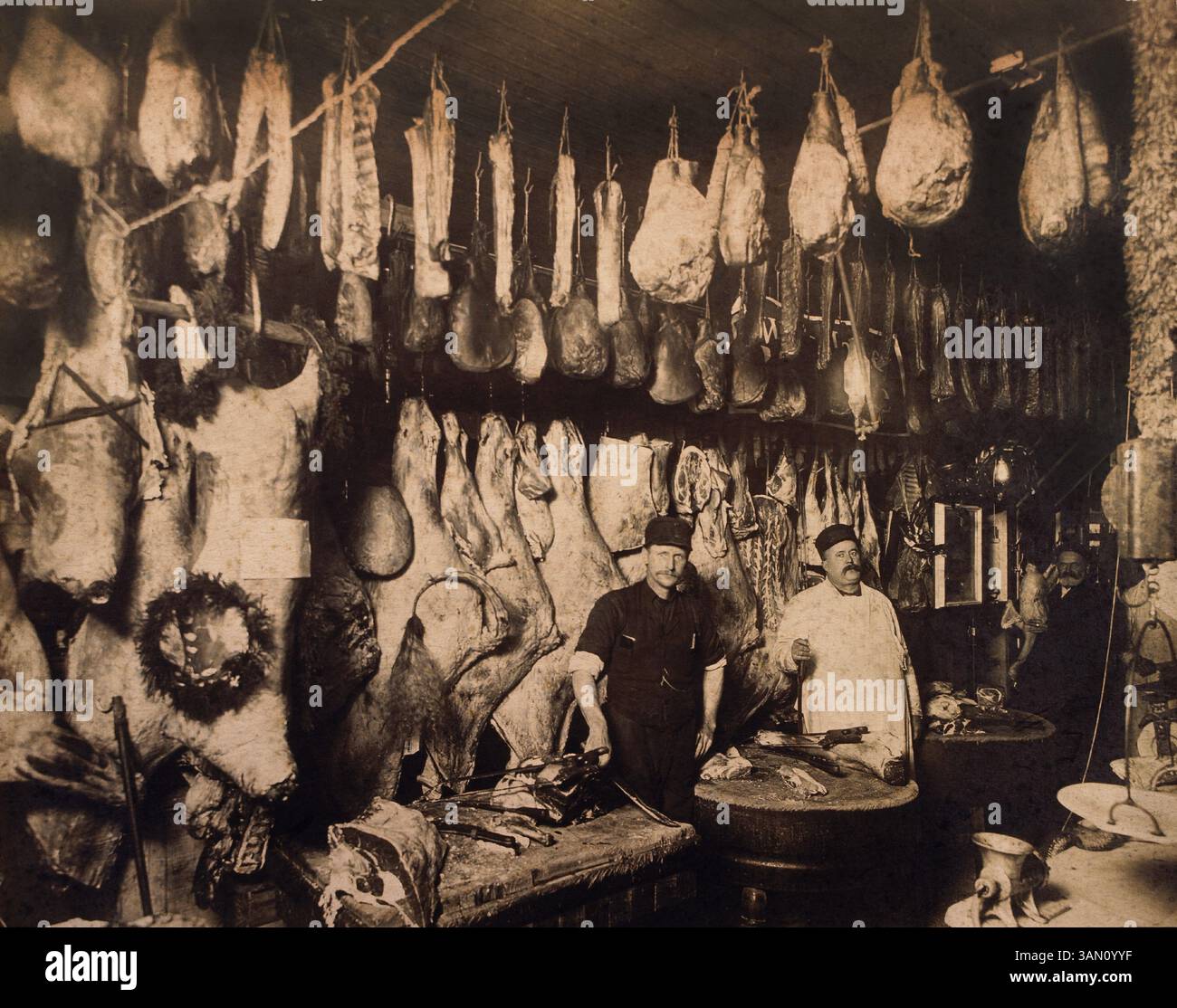 Jan. 1, 1910 - Two Butchers Standing in Front of Large Display of Meat ...